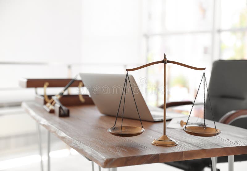 Scales of justice on desk stock image. Image of lawyer - 131329489