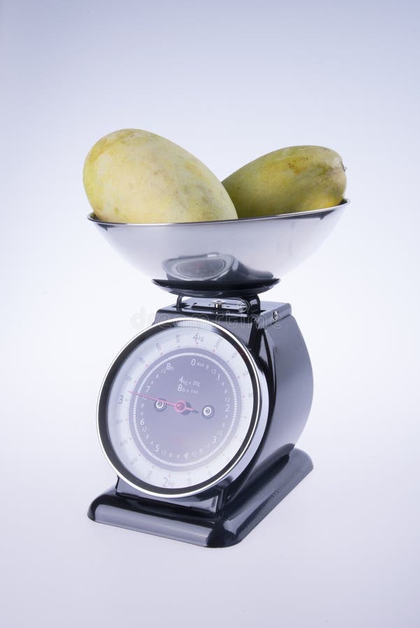 Weighing mango stock photo. Image of balance, weigh, fresh - 85551764