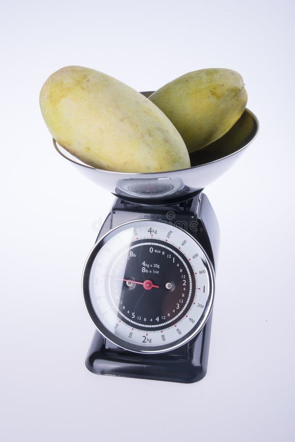 Weighing mango stock photo. Image of balance, weigh, fresh - 85551764