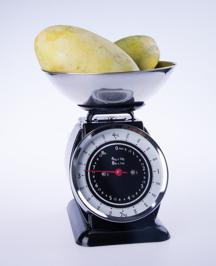 Scales for Kitchen or Kitchen Scales with Mango. Stock Photo - Image of ...