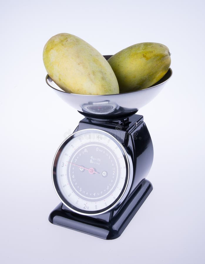 Scales for Kitchen or Kitchen Scales with Mango. Stock Photo - Image of ...