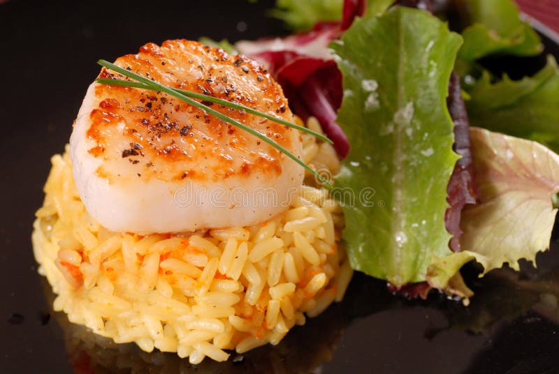 Scallop on Bed of Saffron Rice with Salad Stock Image - Image of ...
