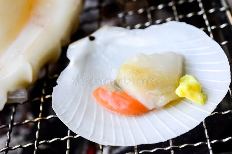 Scallop Seashell on the Grill with Flames Closeup Stock Photo - Image ...