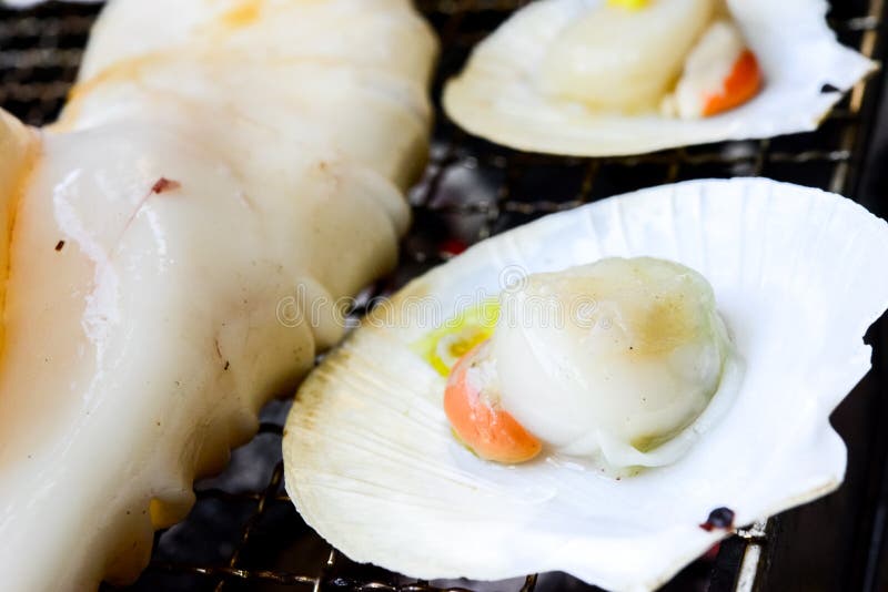 Scallop Seashell on the Grill with Flames Closeup Stock Image - Image ...