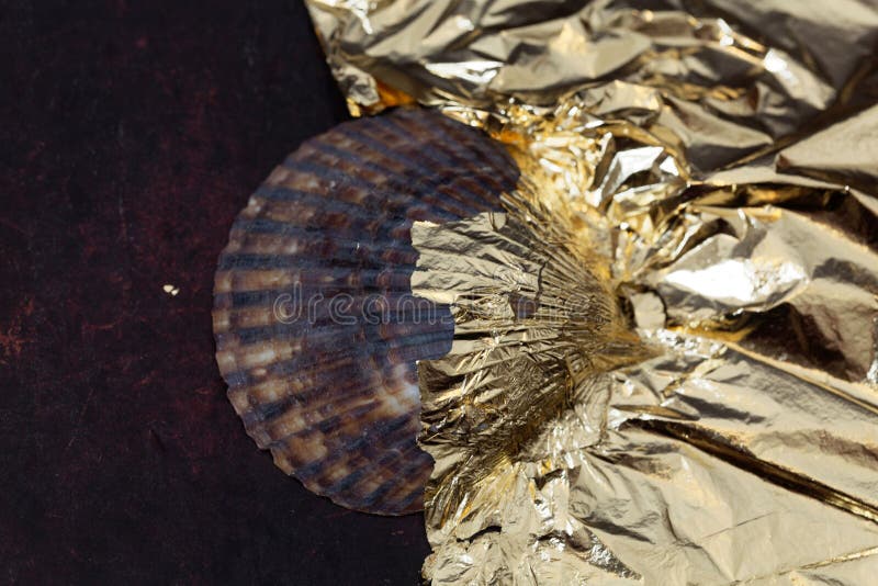 Scallop Shell Partly Covered by Gold Foil for Gilding Stock Image ...