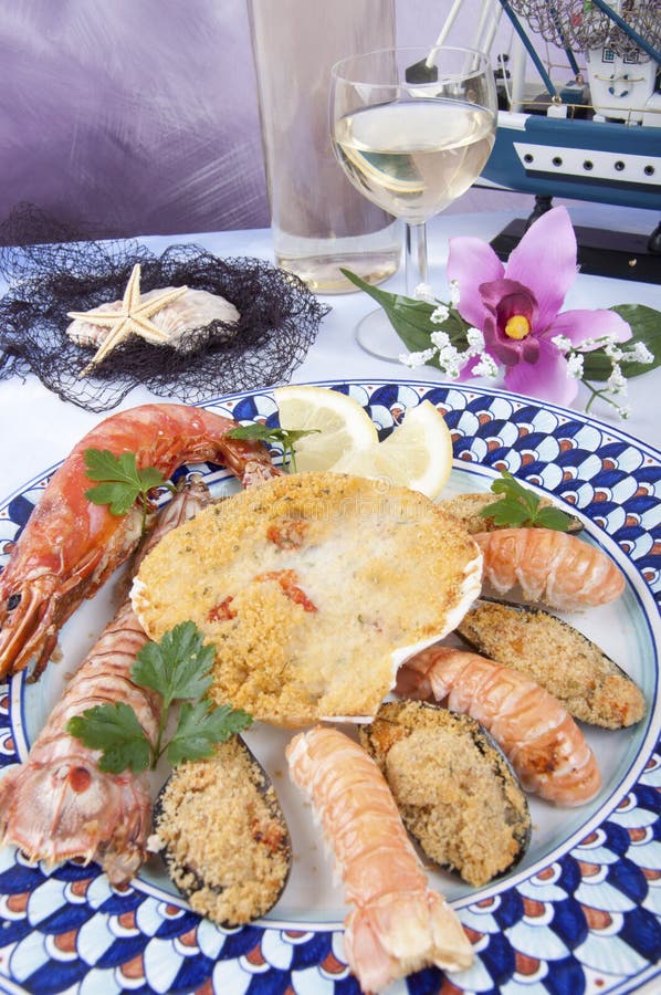 Scallops Baked with Mixed Shellfish Stock Image - Image of parsley ...