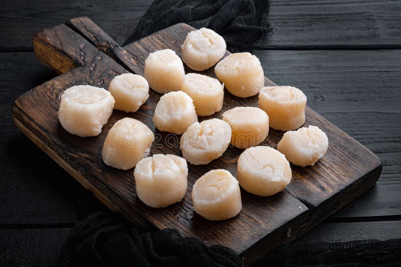 Scallops Meat, on Black Wooden Background Stock Photo - Image of ...