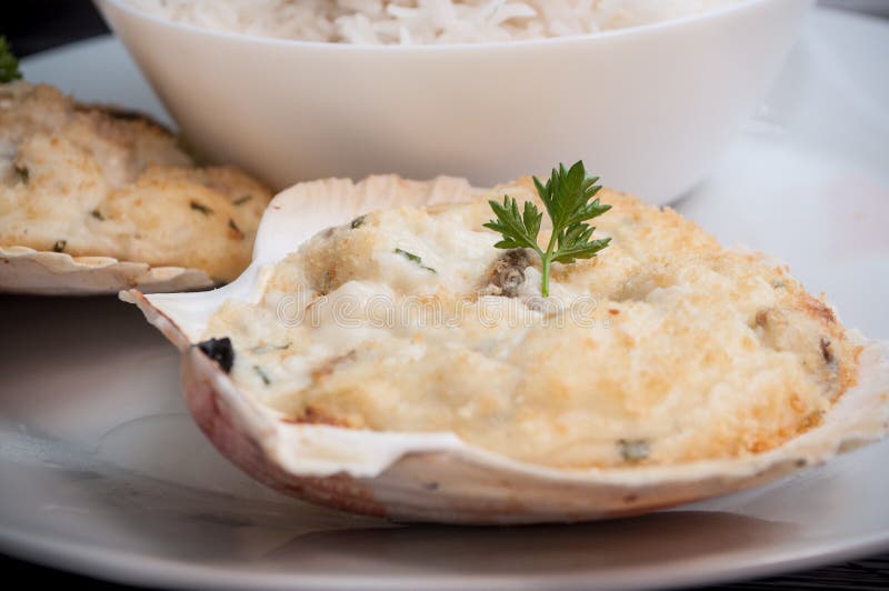 Scallops Shell and Rice in a Plate Stock Photo - Image of plate, baked ...