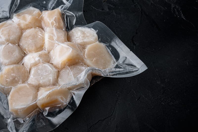 Scallops in Vacuum Pack, on Black Textured Background with Copy Space ...