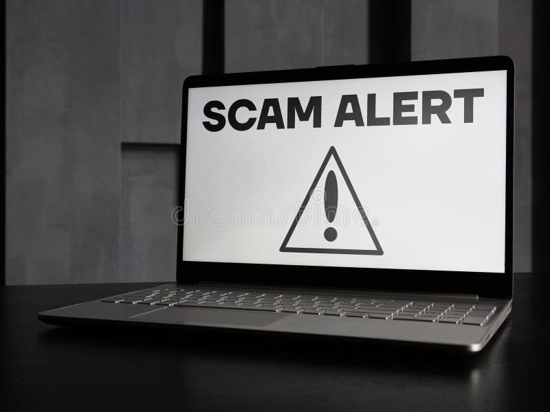 Scam Alert is Shown Using the Text and Photo of Laptop Stock Photo ...