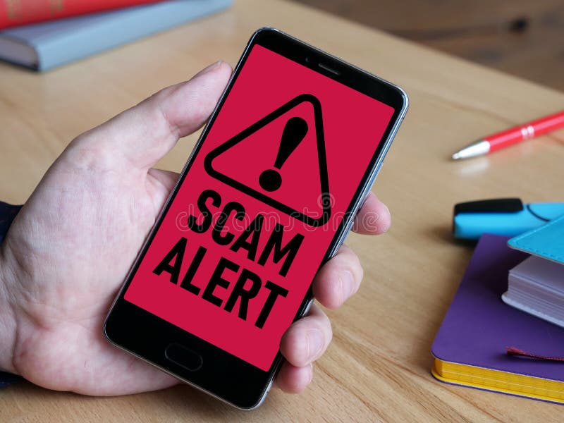 Scam Alert is Shown Using the Text on the Screen of Smartphone Stock ...
