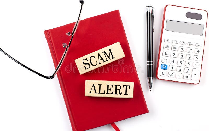 SCAM ALERT Text on Wooden Block on Red Notebook Stock Image - Image of ...