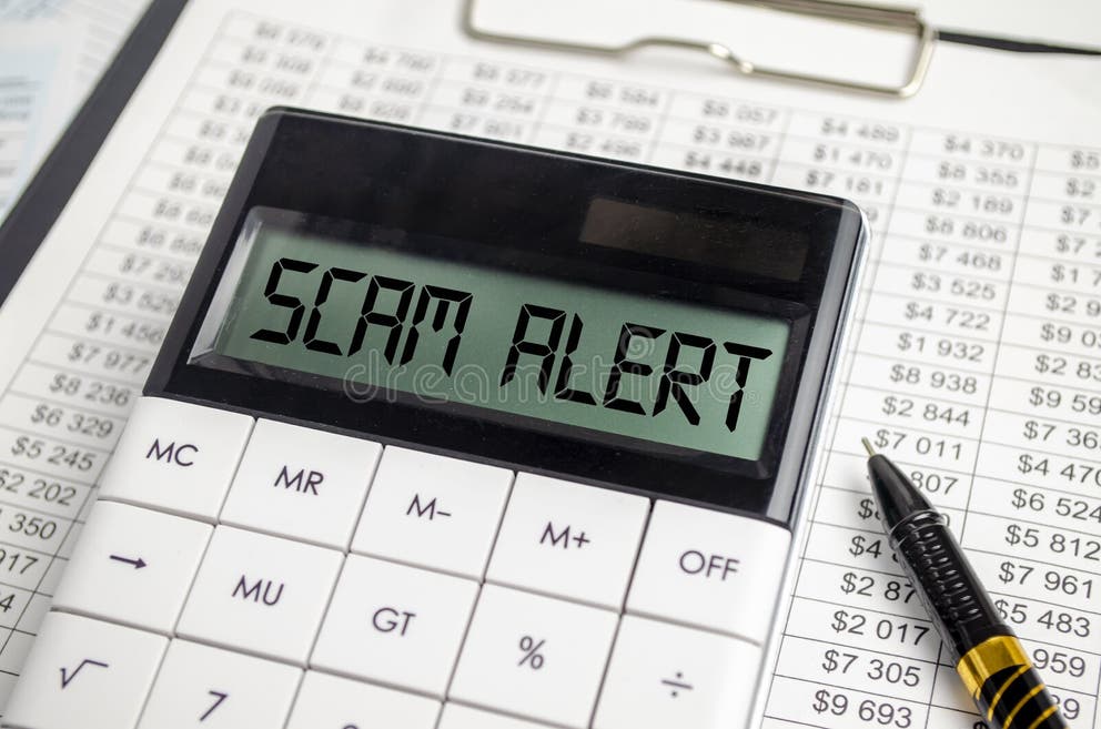 Scam Alert Words on Calculator Display and Charts Stock Photo - Image ...