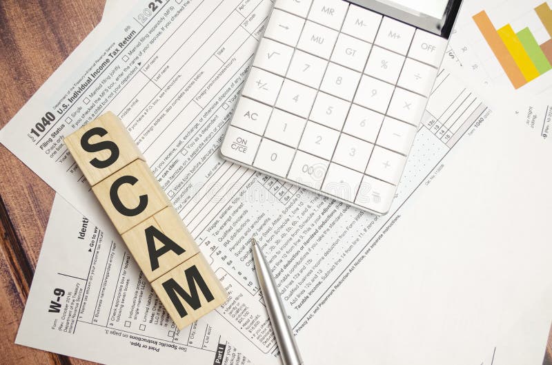 Scam Word Made with Wooden Blocks and Tax Forms Editorial Image - Image ...