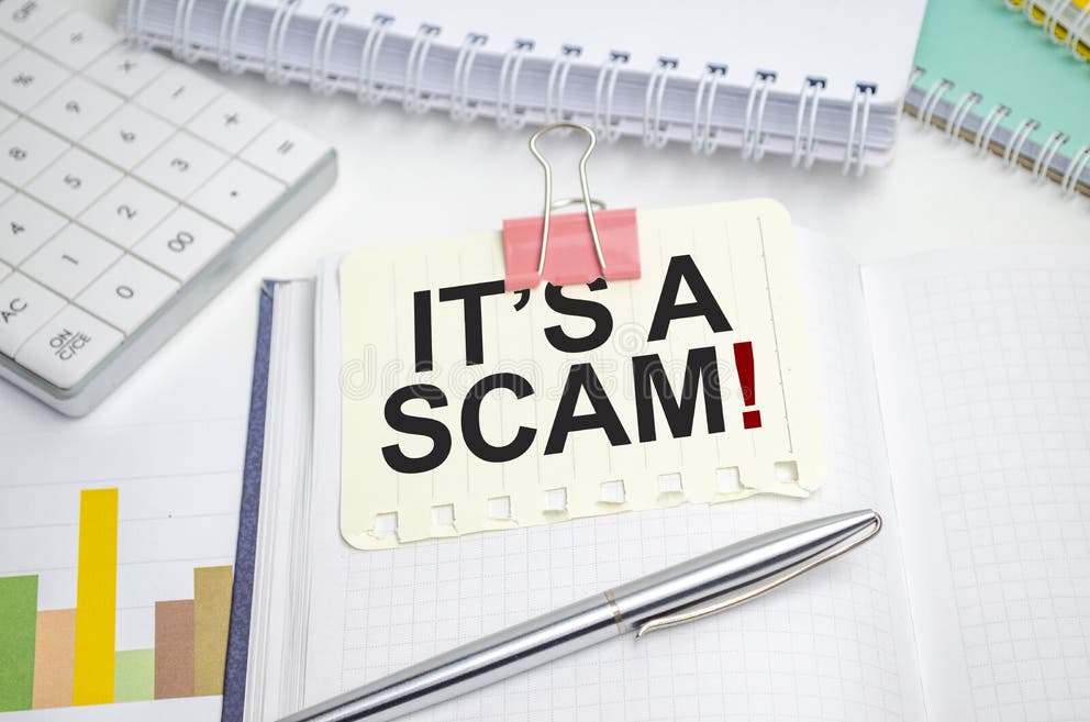 It is a Scam Words on Notebook and Pen, Charts and Calculator Stock ...