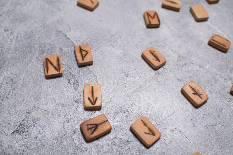 Scandinavian Magic Runes Made of Oak on Concrete. Stock Image - Image ...