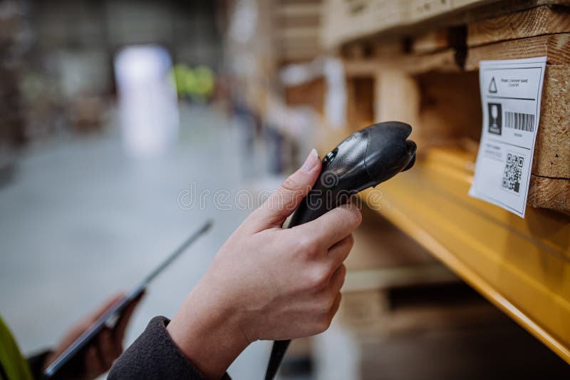Scanner, Scanning the Barcodes on Products in Warehouse. Warehouse ...