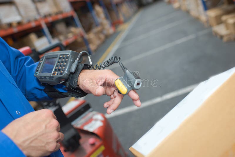 Scanning Parcel in Warehouse with Finger Scanner Stock Image - Image of ...