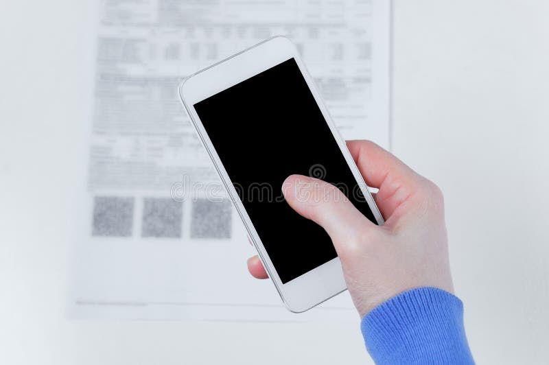 Scanning the QR Code from Document. Smartphone in the Hand of Caucasian ...