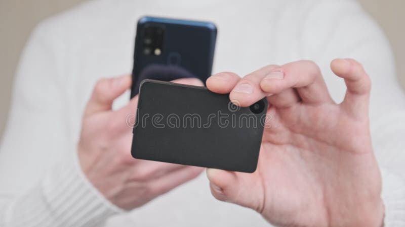 Scanning QR Code with a Modern Cold Crypto Wallet and Smartphone Stock ...