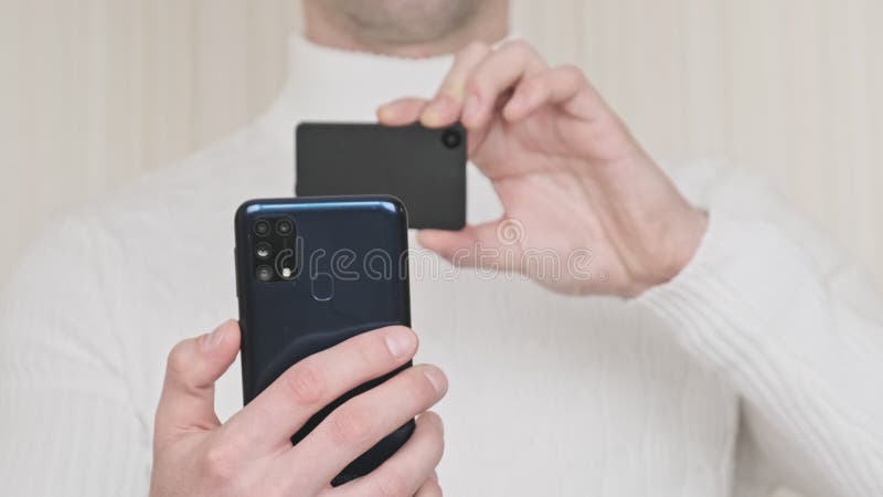 Scanning QR Code with a Modern Cold Crypto Wallet and Smartphone Stock ...