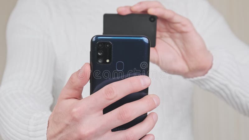 Scanning QR Code with a Modern Cold Crypto Wallet and Smartphone Stock ...