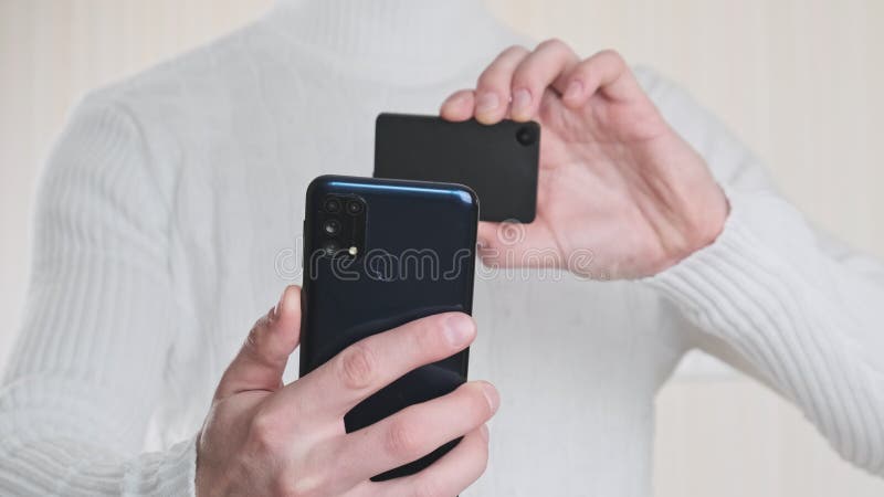 Scanning QR Code with a Modern Cold Crypto Wallet and Smartphone Stock ...