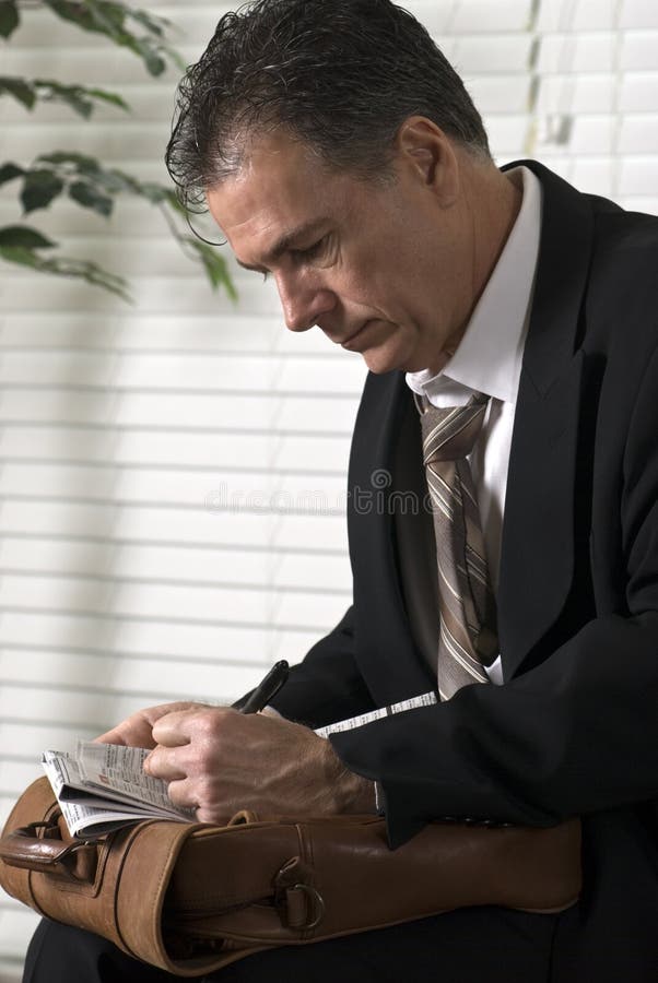 Scanning the Want Ads stock photo. Image of discouraged - 9173580