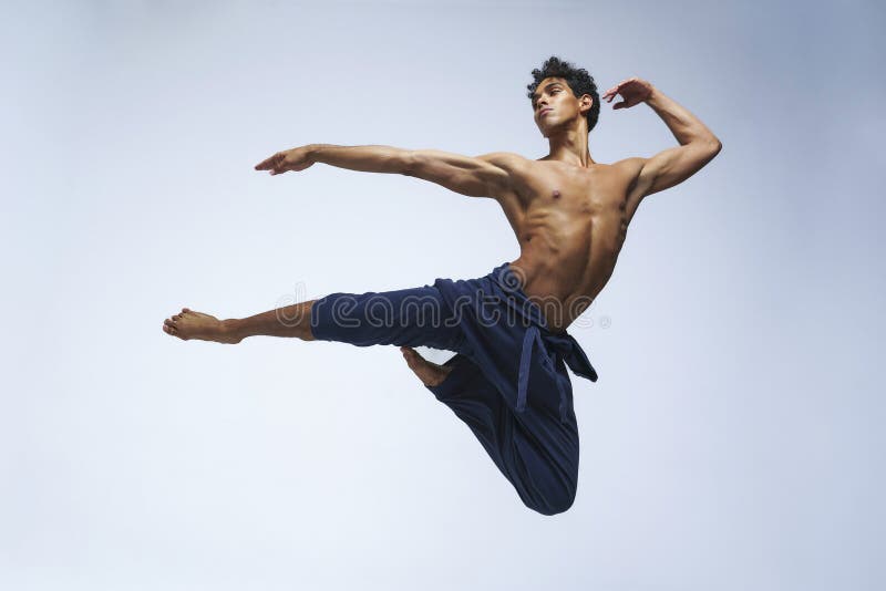 Scantily Clad Mulatto Dancer, Ballet Dancer, Man Shows Ballet Jumps ...