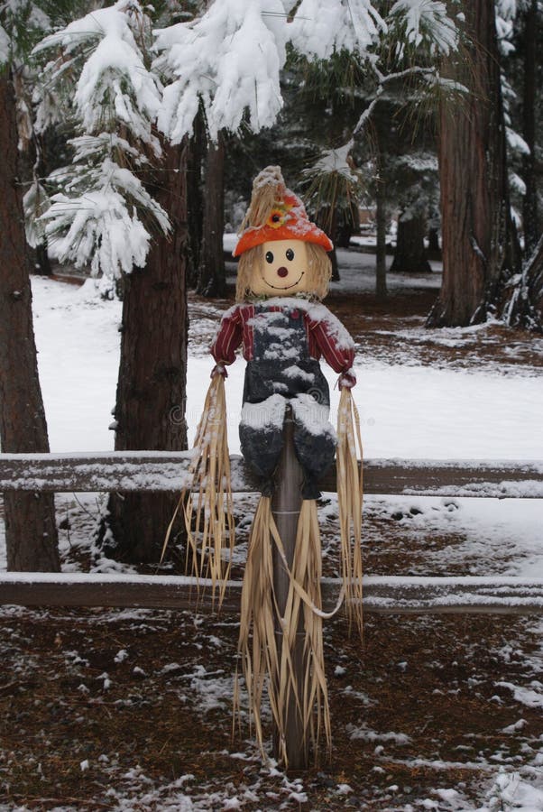 Scarecrow in First Winter Snow Stock Photo - Image of winter, sitting ...