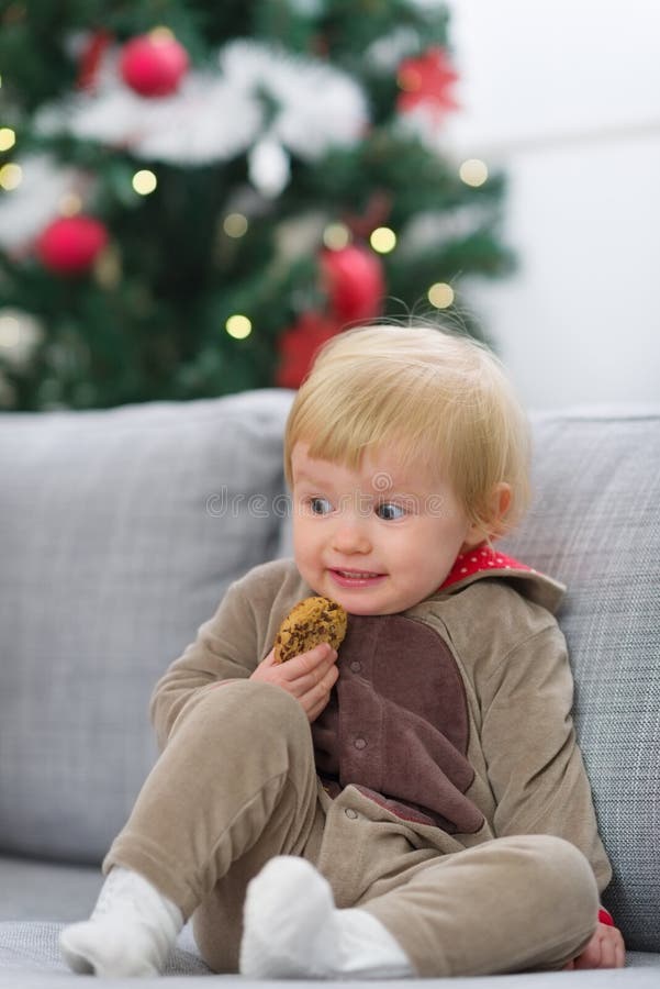 Scared Baby in Christmas Deer Suit with Cookie Stock Image - Image of ...
