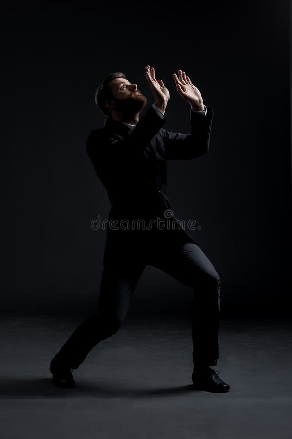 Scared Businessman on a Black Background Stock Photo - Image of defense ...