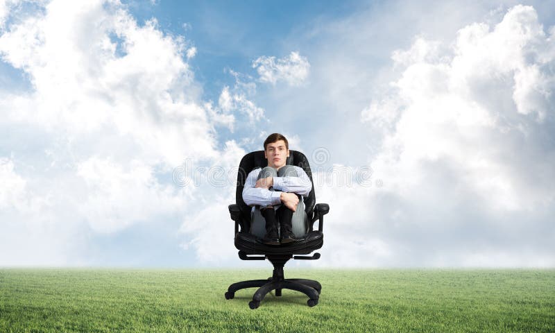 Scared Businessman on a Chair Stock Photo - Image of side, nature ...