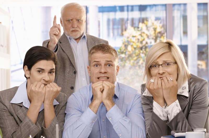Scared Employees Sitting with Angry Boss Behind Stock Image - Image of ...