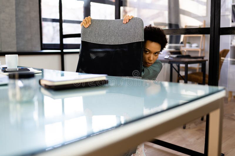 Scared Female Hiding Under Desk Stock Photo - Image of afraid, edge ...