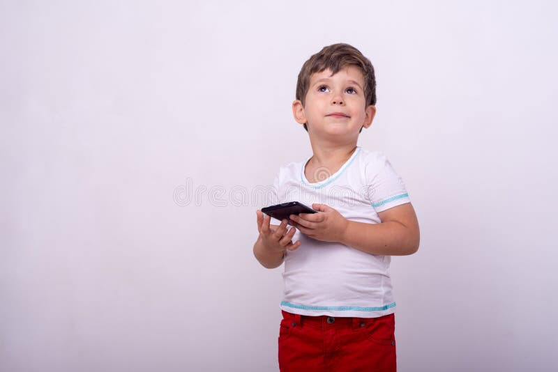 Scared Kid with Smartphone in His Hands. Shocked Child, Shocking ...