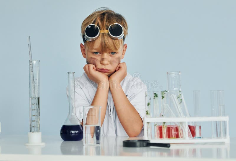 Scared Little Boy in Coat Playing a Scientist in Lab by Using Equipment ...