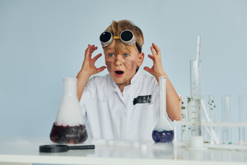 Scared Little Boy in Coat Playing a Scientist in Lab by Using Equipment ...