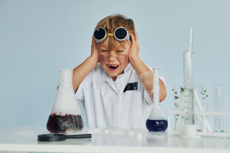 Scared Little Boy in Coat Playing a Scientist in Lab by Using Equipment ...