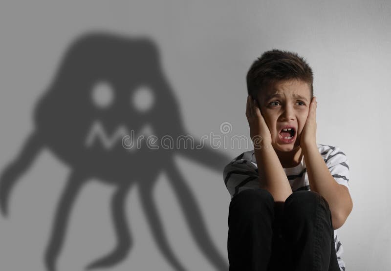 Shadow of Monster on Wall and Scared Teenage Girl in Room Stock Image ...