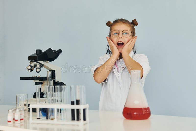 Scared Little Girl in Coat Playing a Scientist in Lab by Using ...