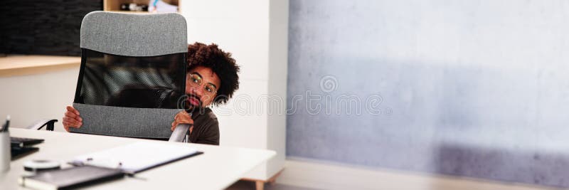 Scared Man Hiding Behind Office Desk Stock Image - Image of scared ...