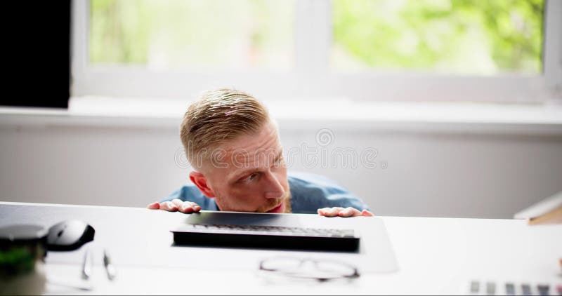 Scared Man Hiding Behind Office Desk Stock Photo - Image of peeking ...