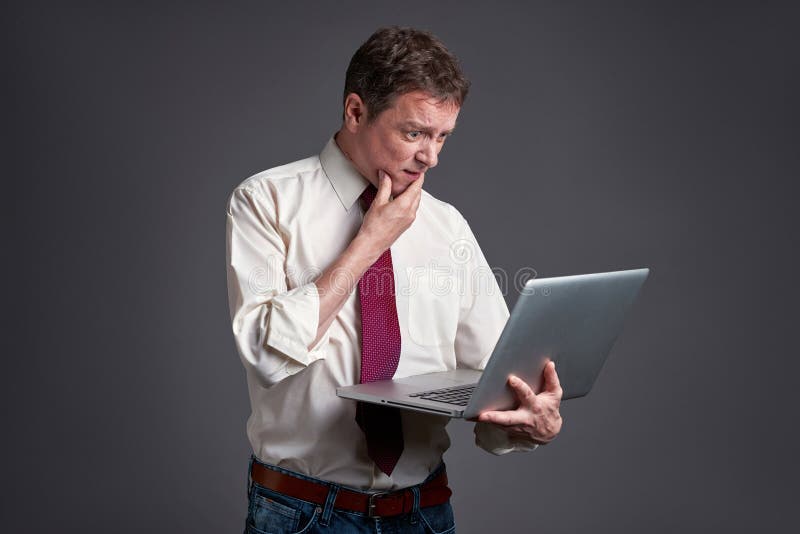 Scared Man with a laptop stock photo. Image of holding - 76507484