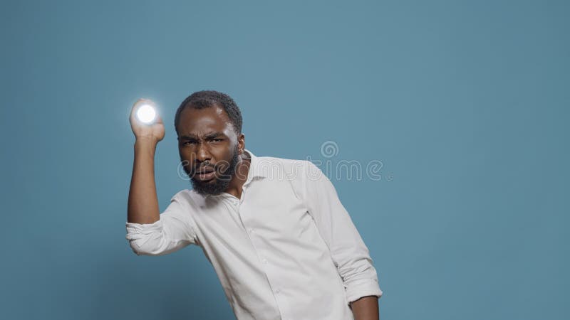 Scared Man Using Lantern To Make Light and Look Around Stock Image ...