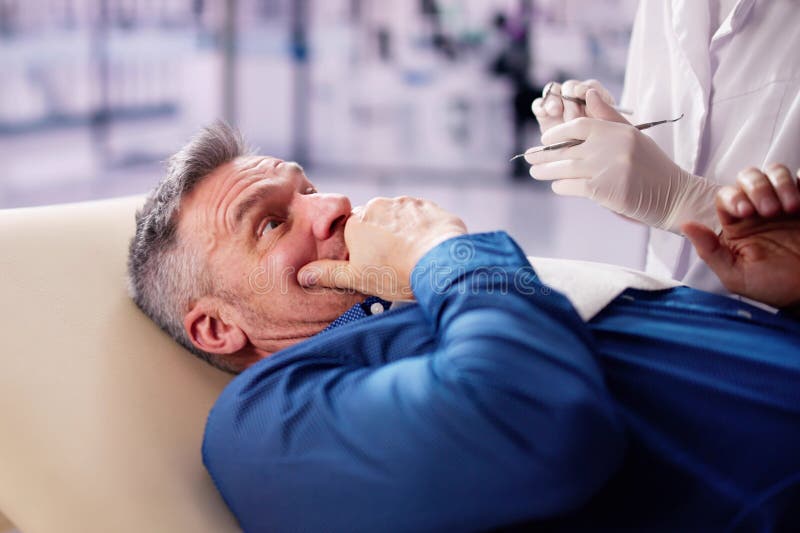 Scared Patient at Dentist stock image. Image of hygienist - 311162945