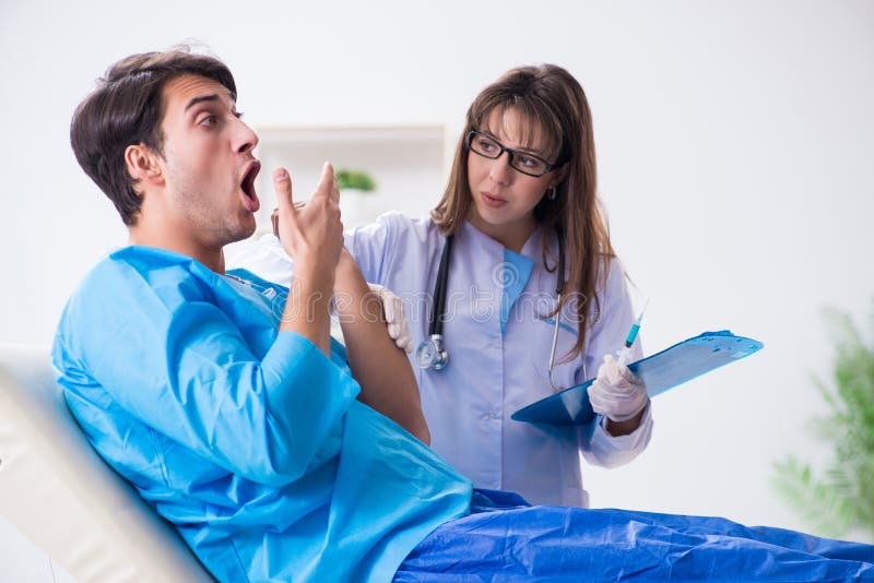 The Scared Patient Man Getting Ready for Flu Shot Stock Photo - Image ...