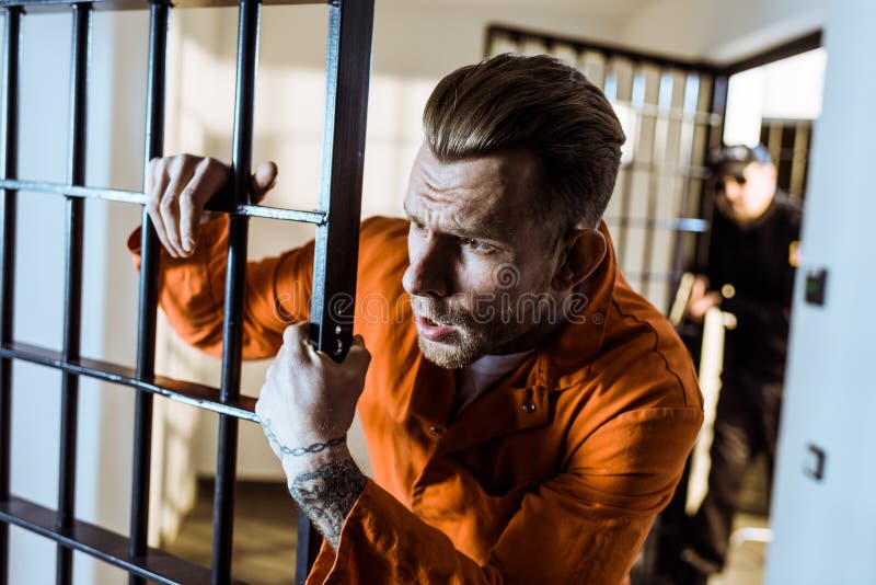 Scared prisoner leaning stock photo. Image of conclusion - 129292298