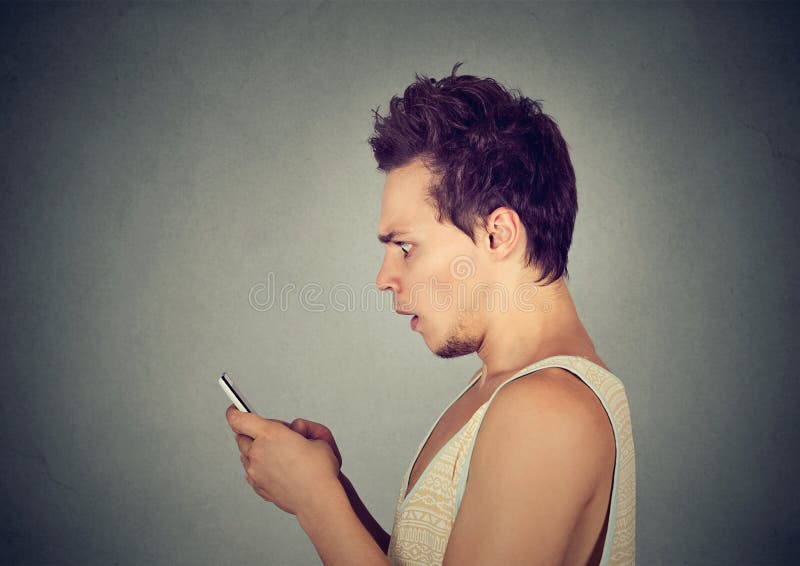 Scared Shocked Young Man Holding Looking at His Mobile Phone Stock ...