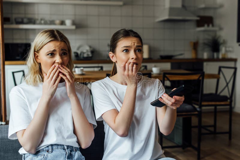 And Scared Sisters Watching Tv on Stock Photo - Image of scared, couch ...